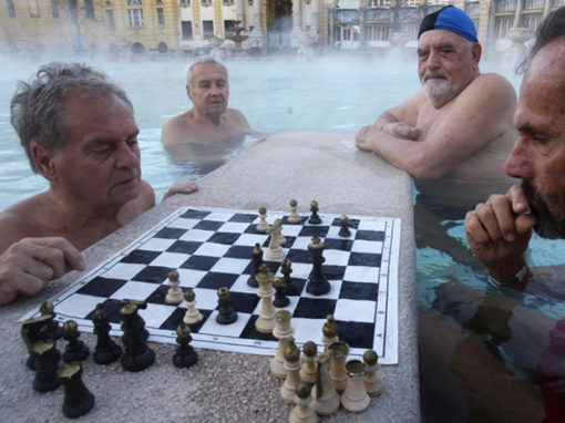 People play chess in Szechenyi Bath during a winter morning in Budapest ...